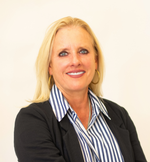 Stacey Ellis, a middle-aged blonde woman smiling for the camera ...